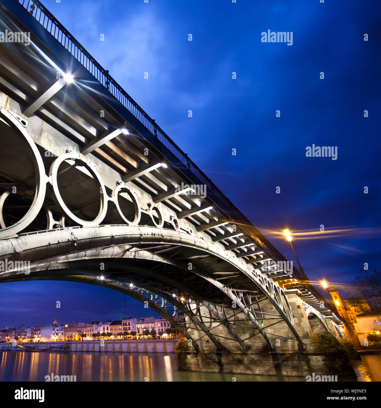 Panorama of Seville riverside at down under the Triana Bridge, the ...