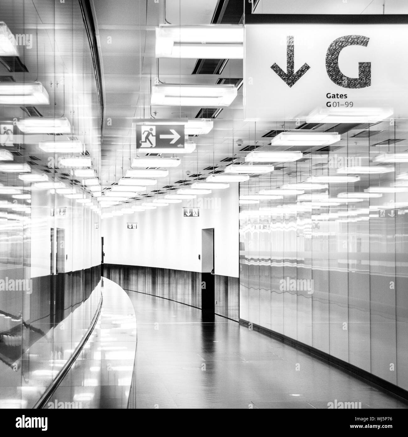 Contemporary illuminated airport terminal hall Stock Photo - Alamy