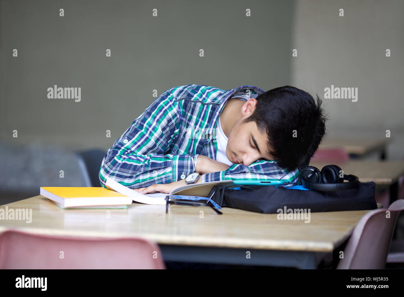 College student napping in a cafeteria Stock Photo - Alamy