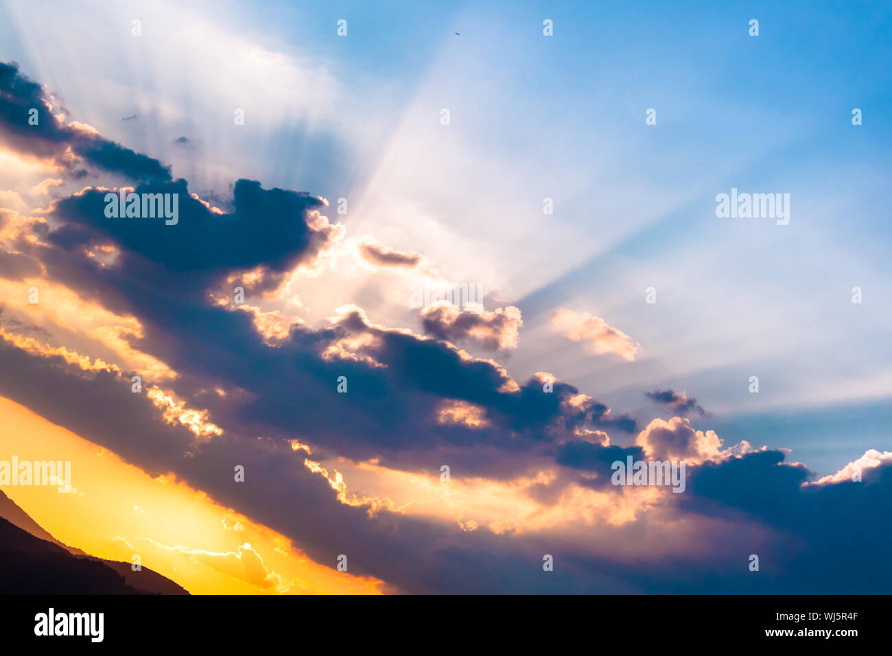 Sunset / sunrise with clouds, light rays and other atmospheric effect ...