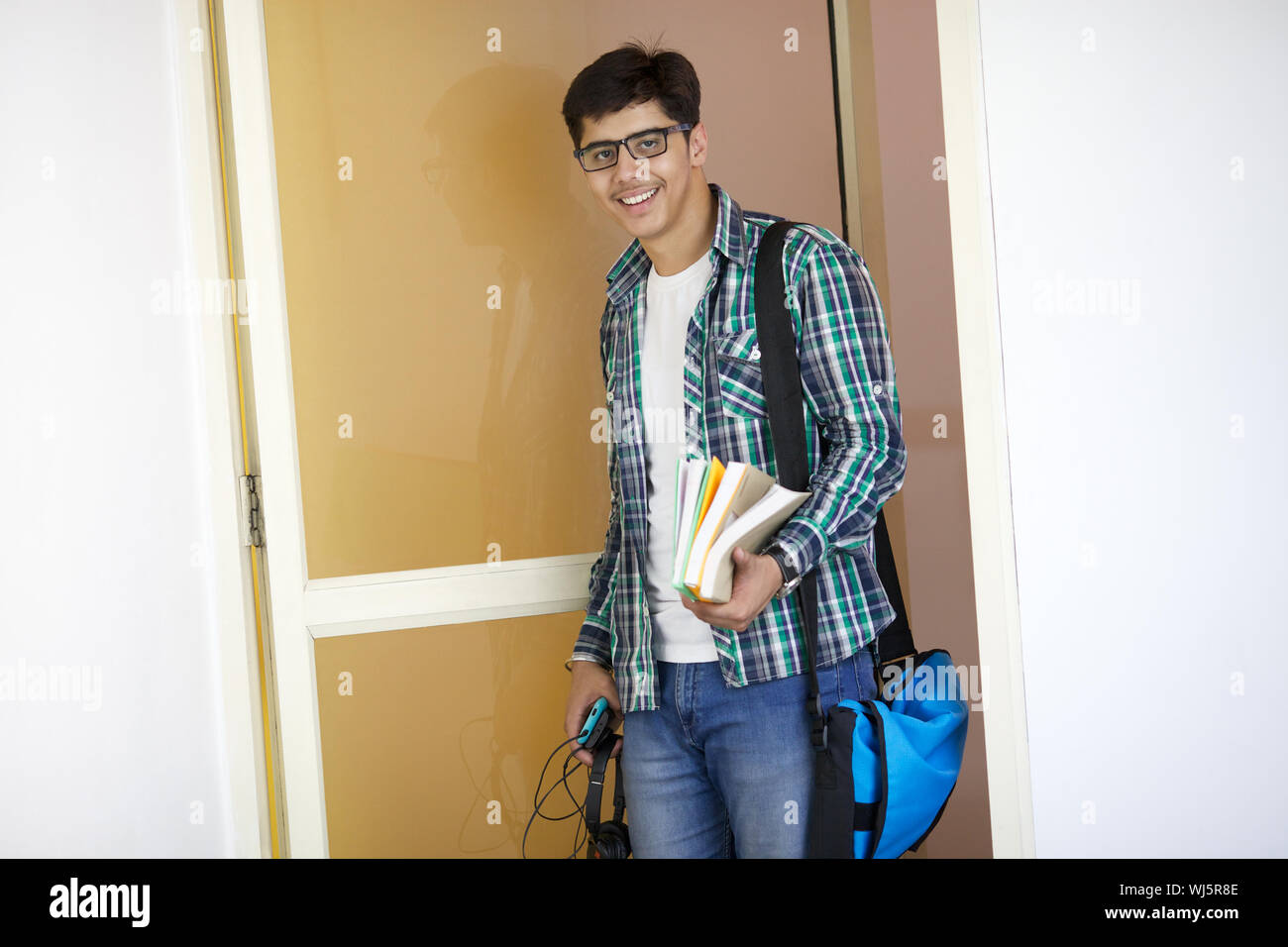 College student entering in a classroom Stock Photo - Alamy