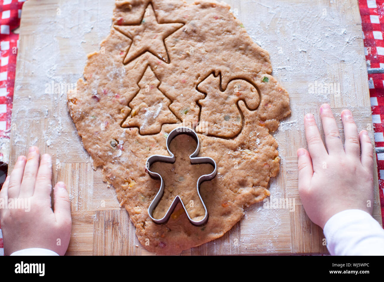 Child hands making from dough gingerbread man for Christmas Stock Photo ...