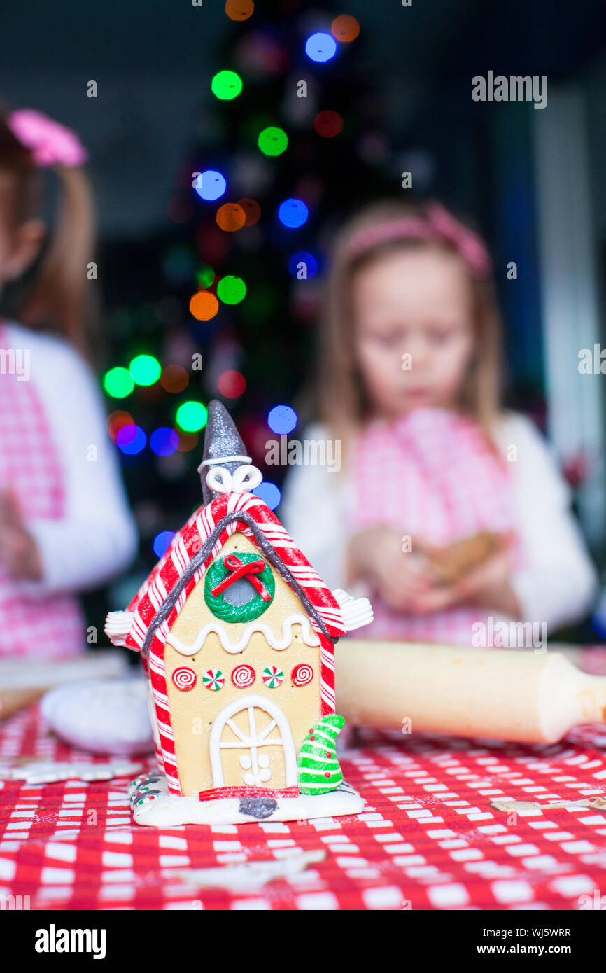 Gingerbread fairy house decorated by colorful candies on a background ...