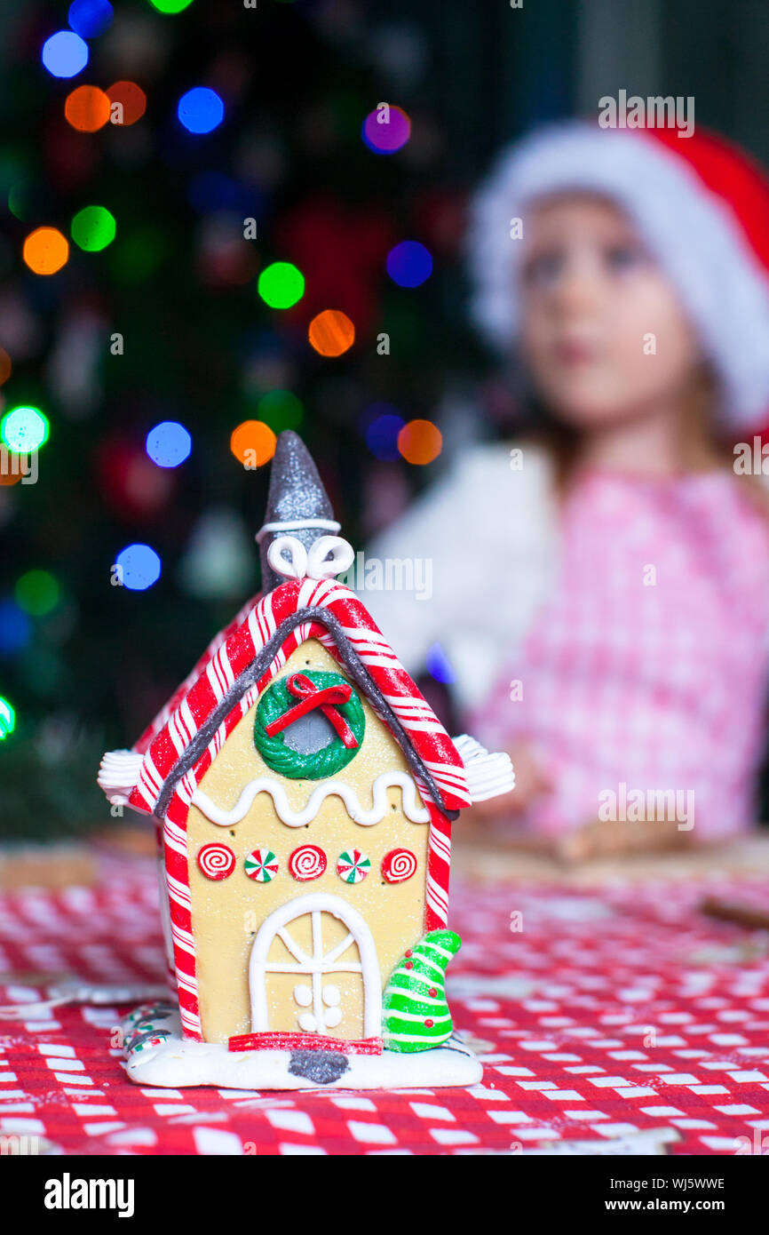 Gingerbread fairy house decorated by colorful candies on a background ...
