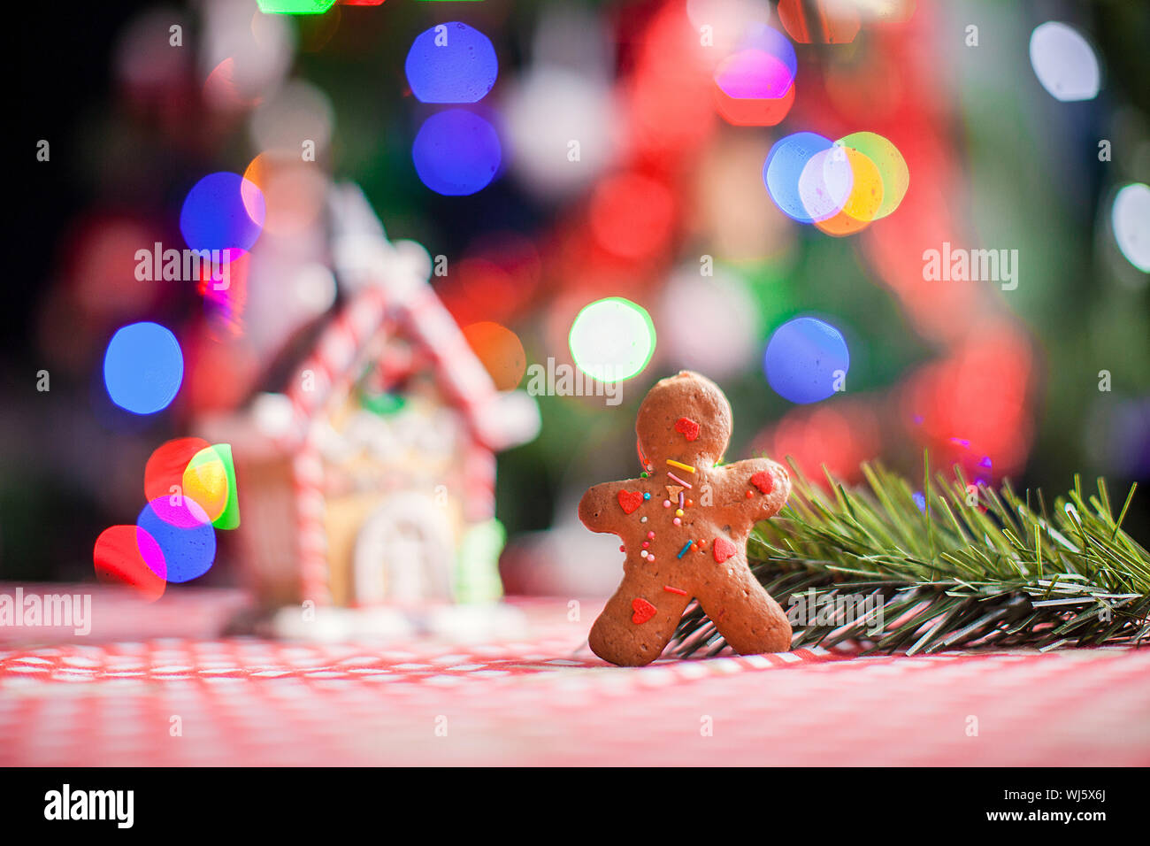 Close-up of gingerbread man background candy ginger house and Christmas ...