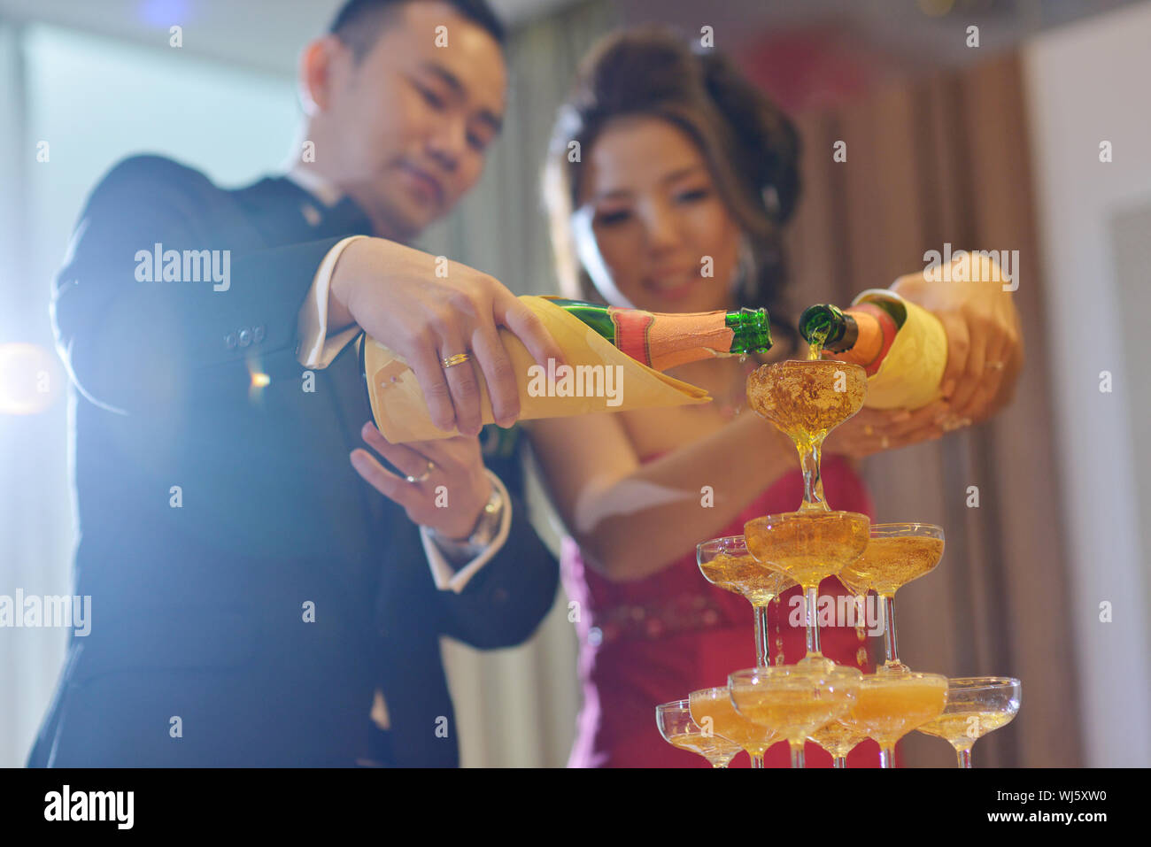 Asian Chinese wedding dinner reception, bride and groom champagne ...