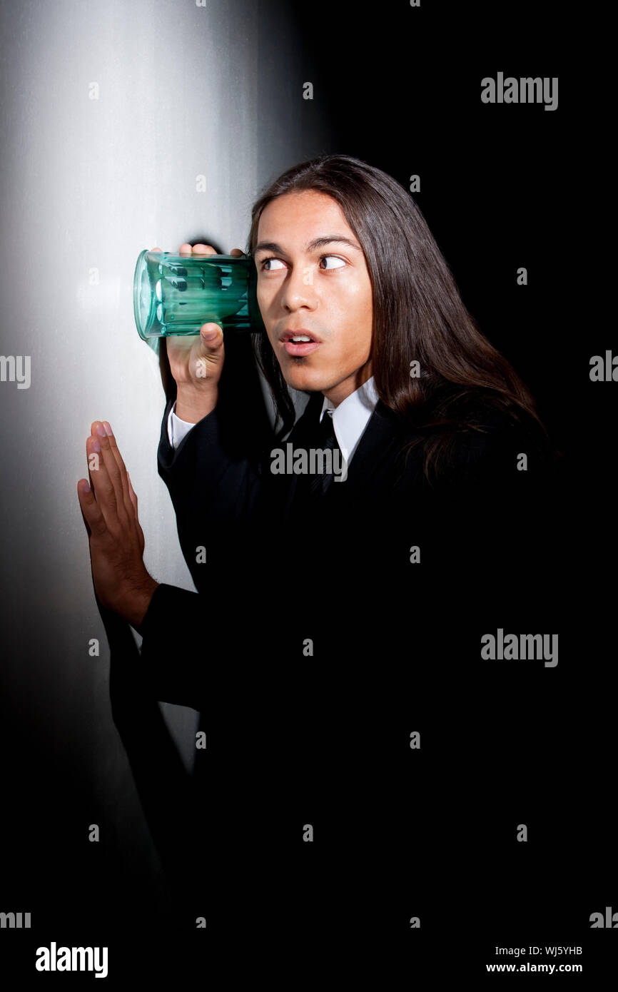 Glass to wall eavesdrop hi-res stock photography and images - Alamy