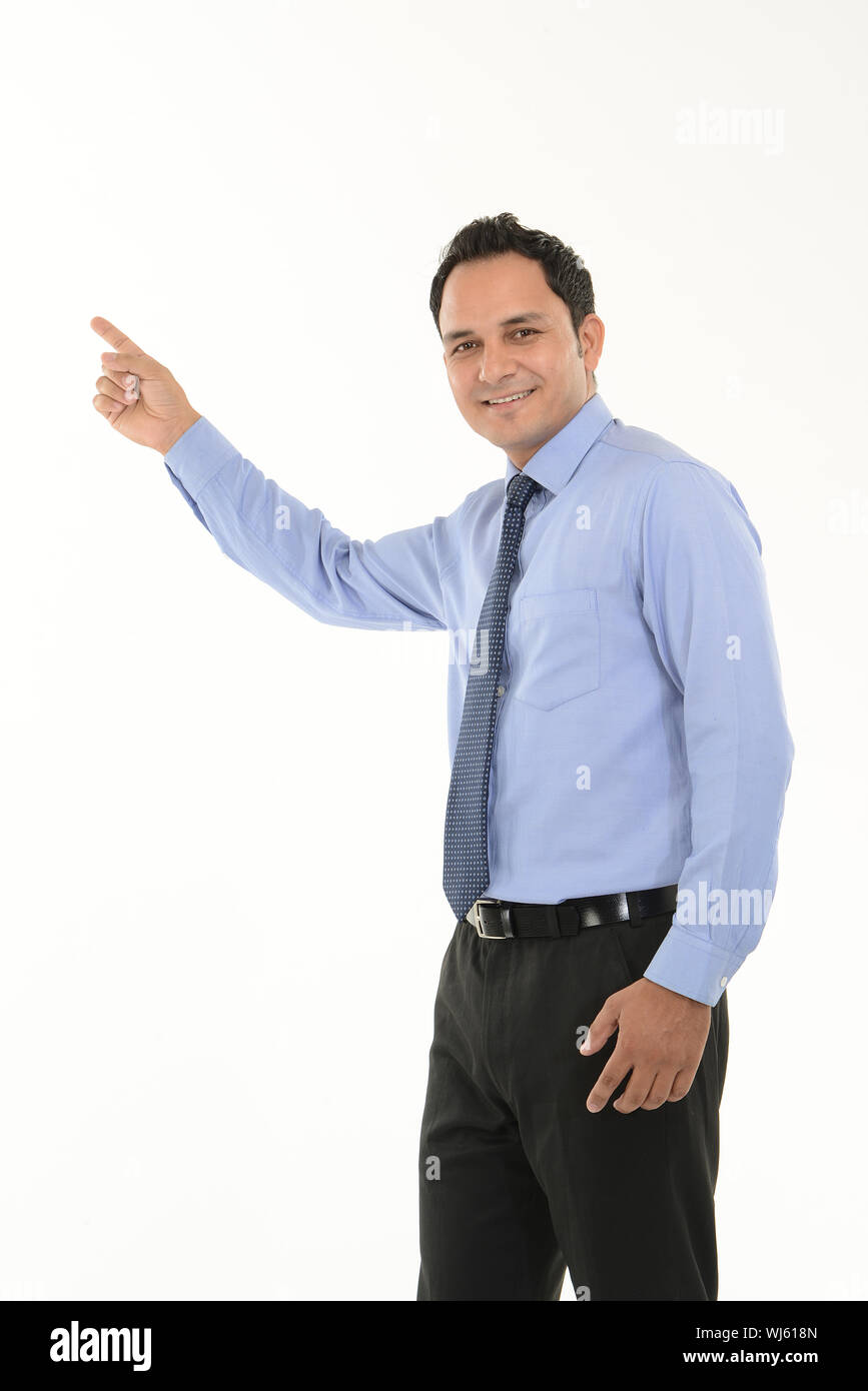 Businessman showing something and smiling Stock Photo - Alamy