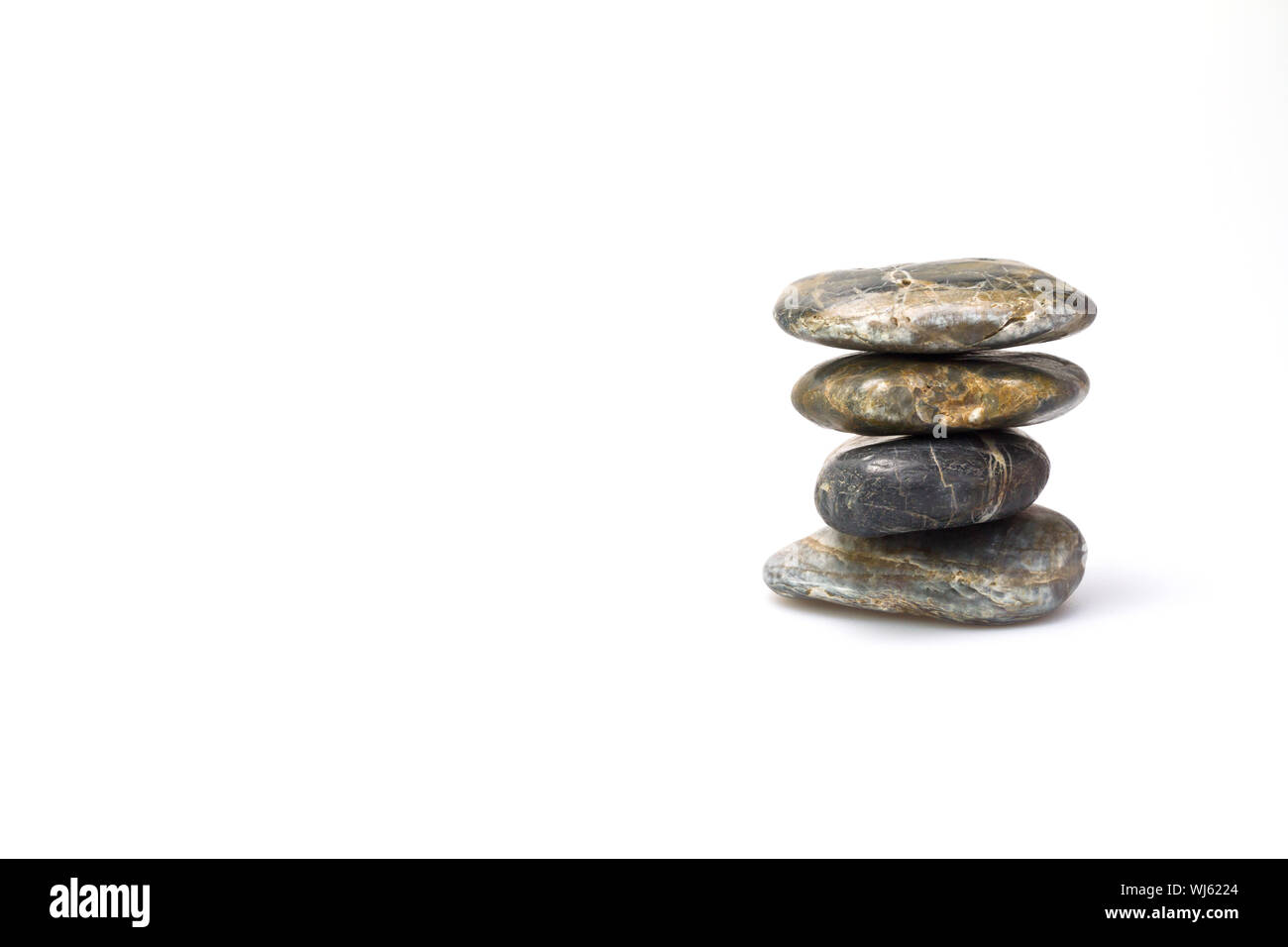 Baancing stones on white background right hand margin landscape ...
