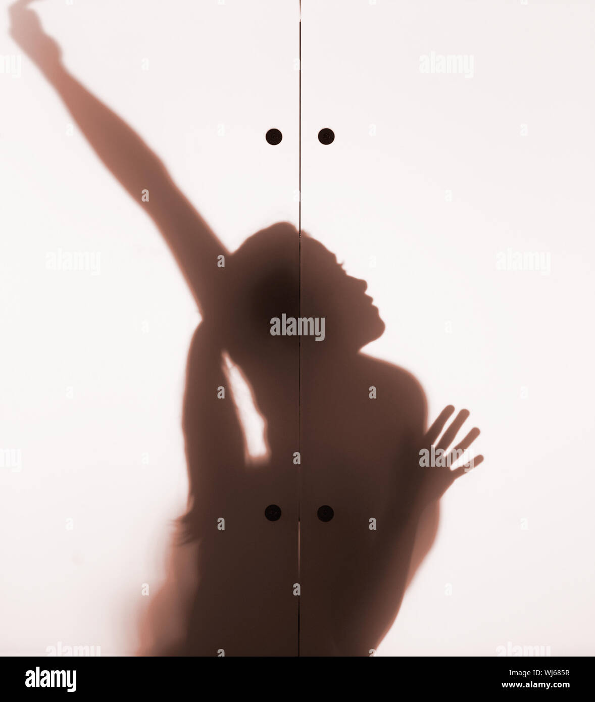 woman shadow behind door Stock Photo - Alamy