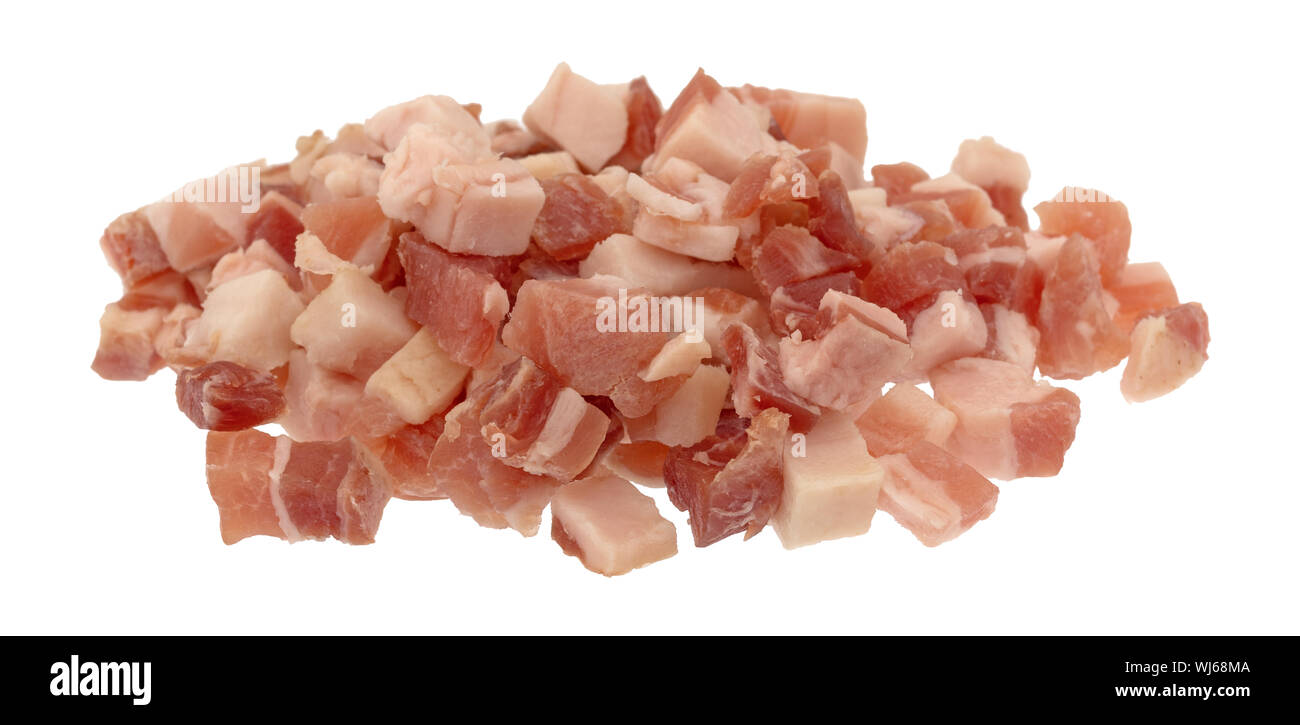 Side view of a portion of pancetta sliced into cubes on a white ...