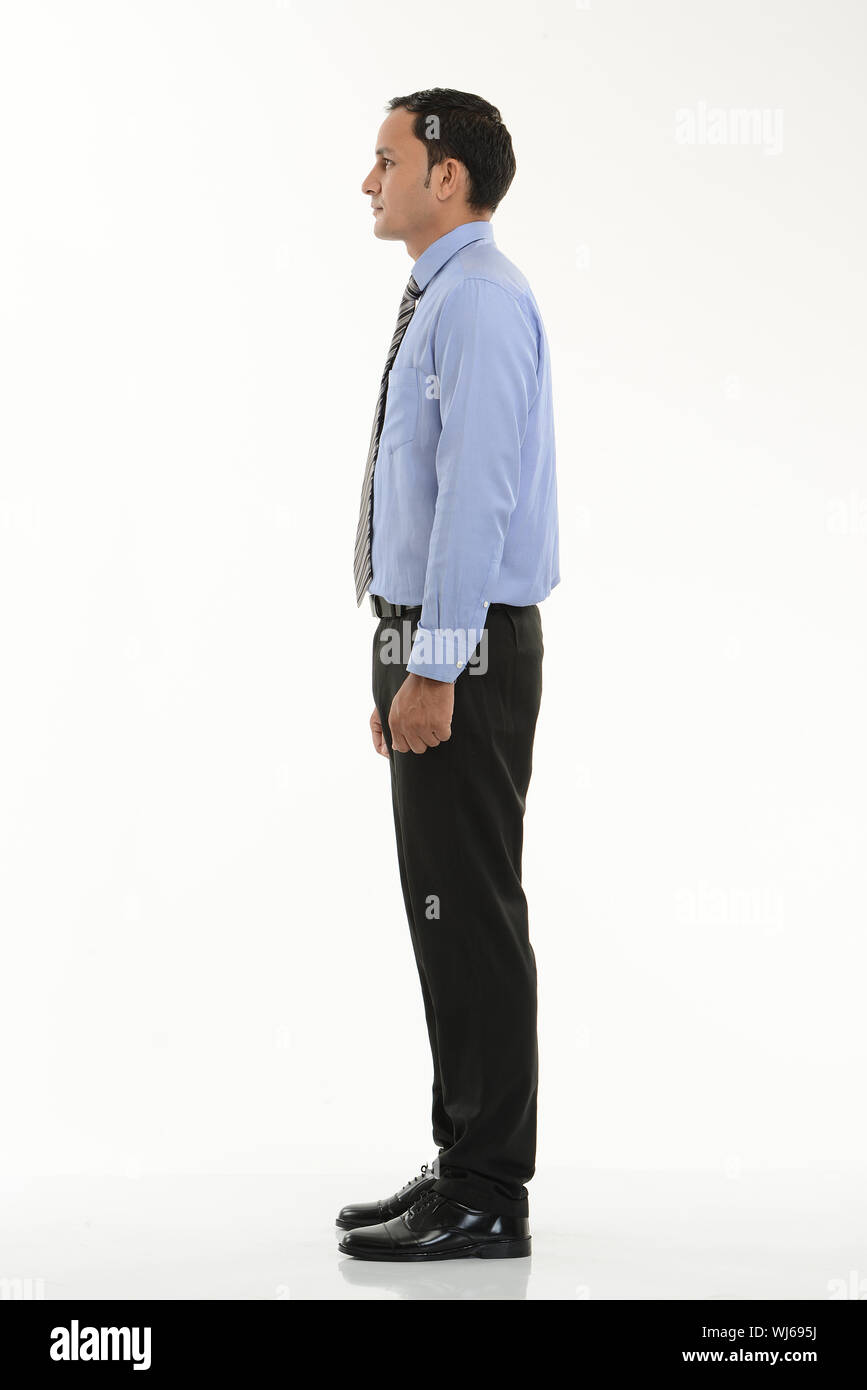 Side profile of a businessman standing Stock Photo - Alamy