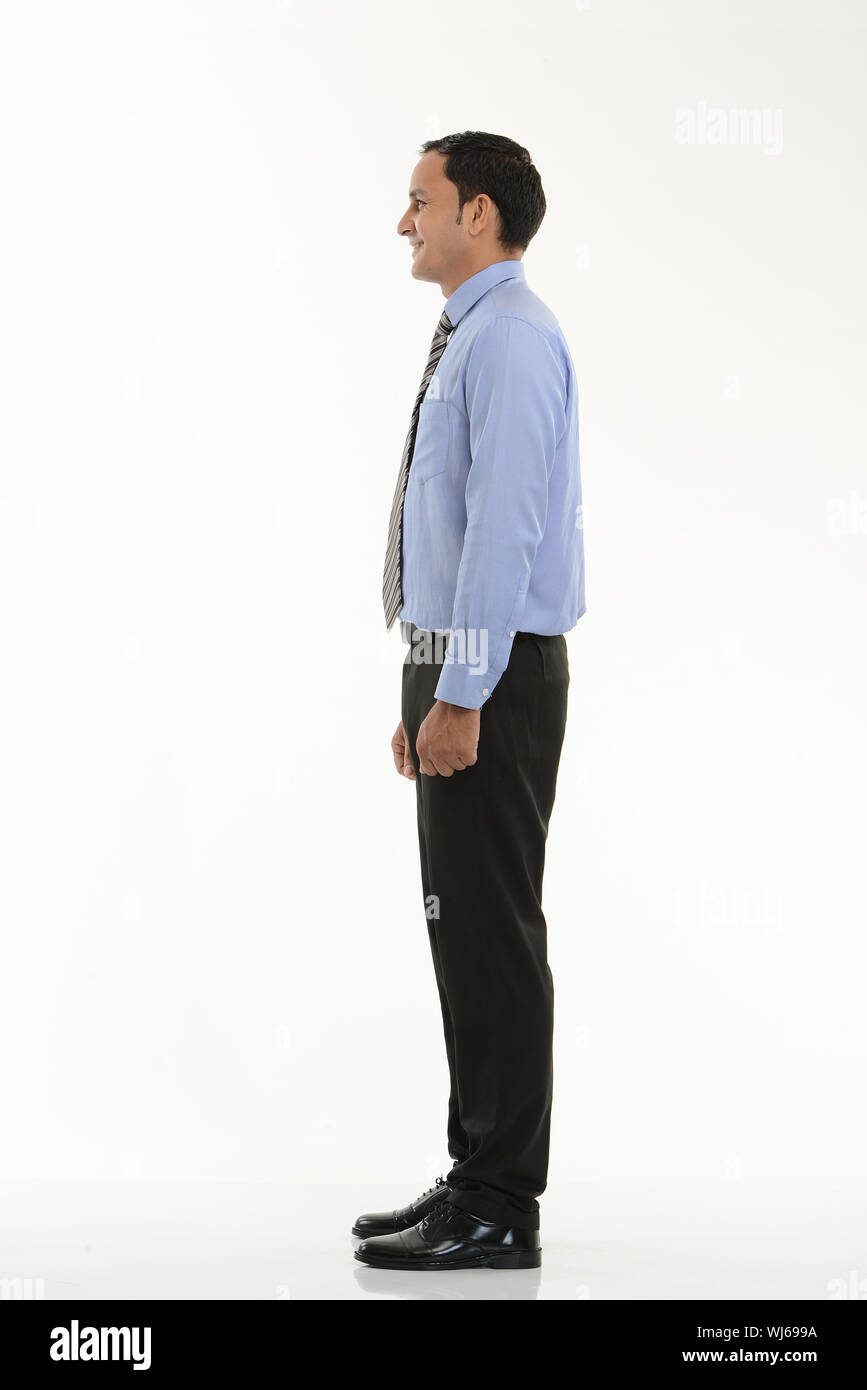 Side profile of a businessman standing Stock Photo - Alamy