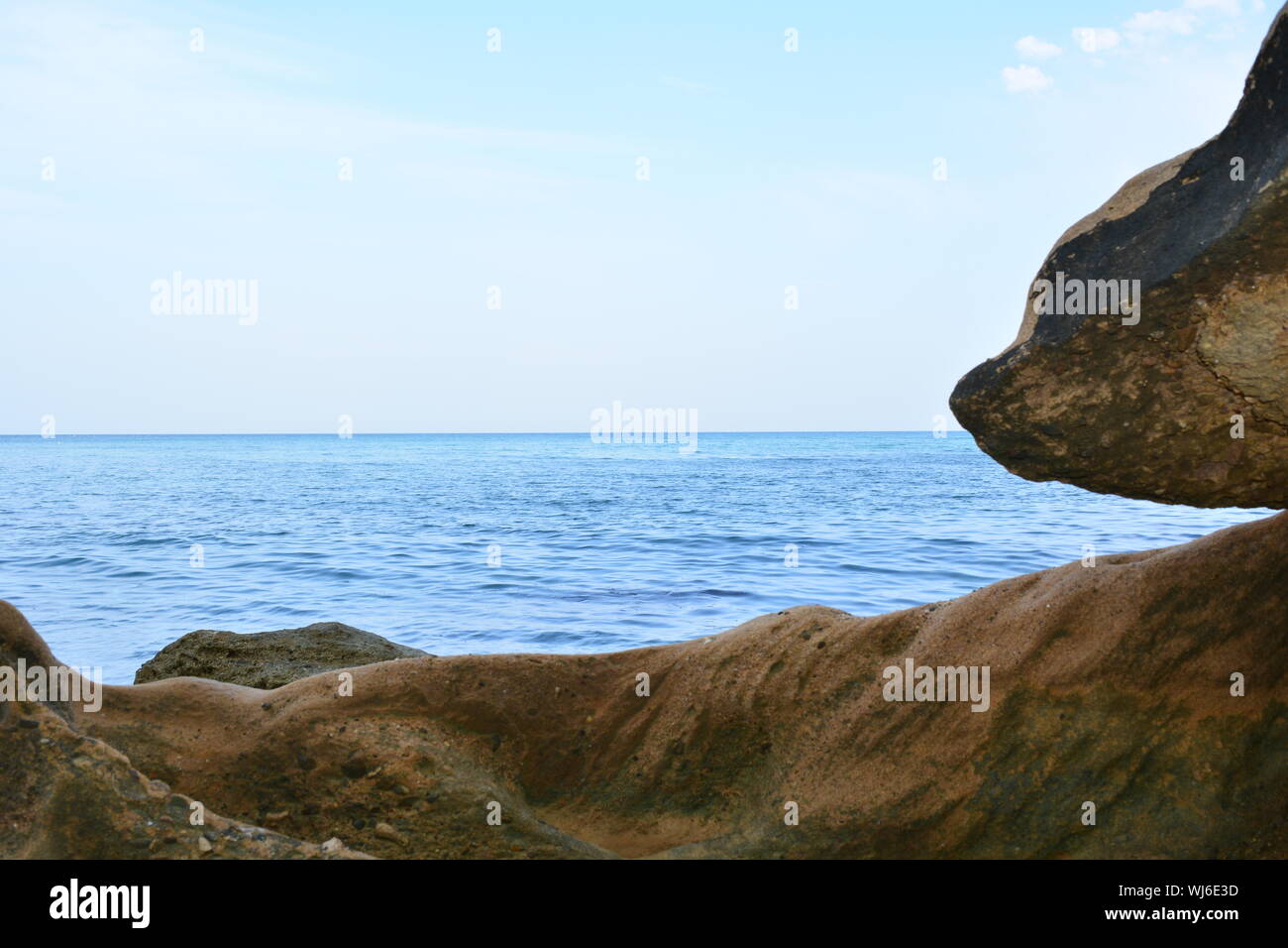 blue sea cliffs wild beaches high cliffs Stock Photo - Alamy