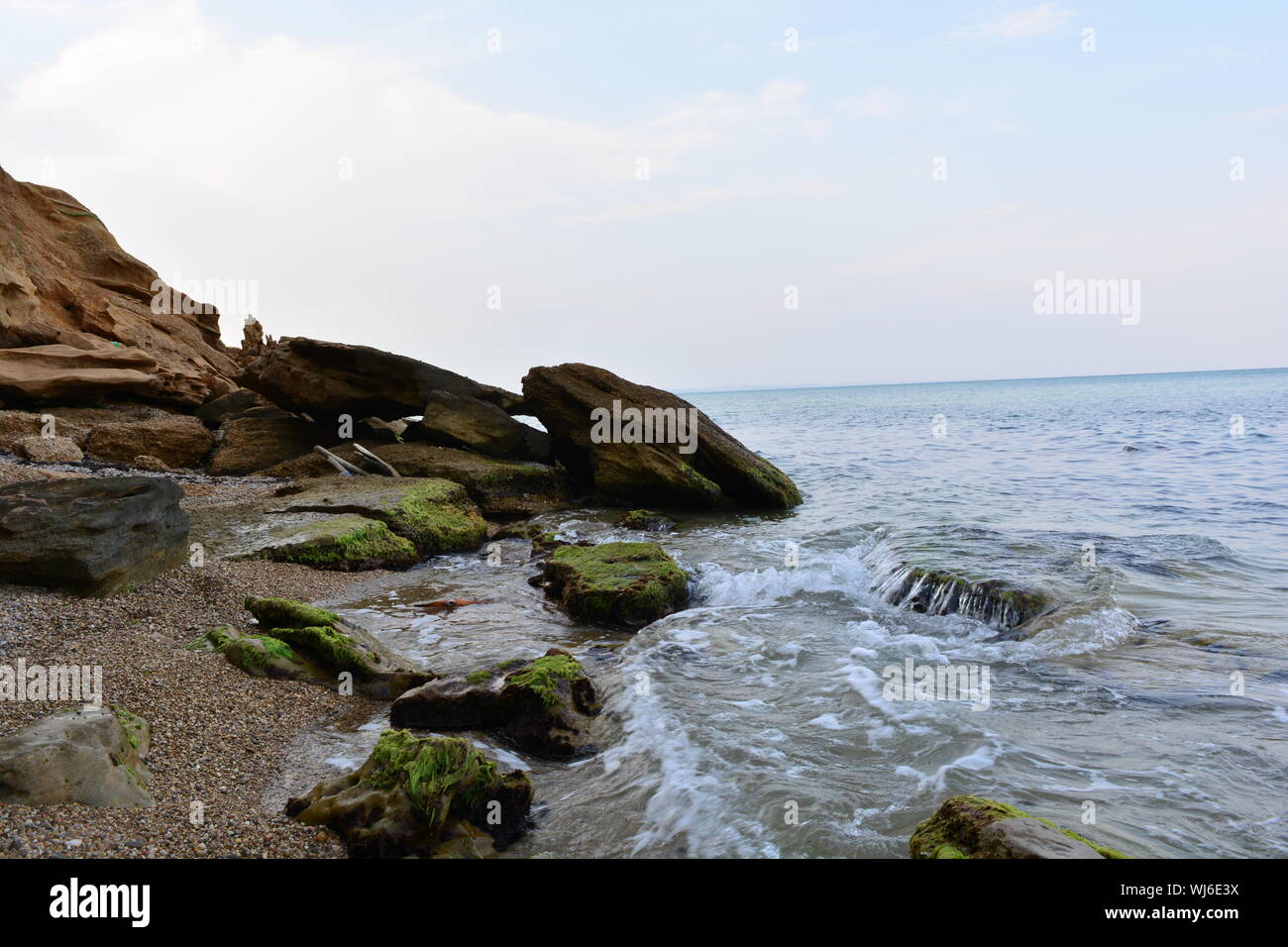 blue sea cliffs wild beaches high cliffs Stock Photo - Alamy