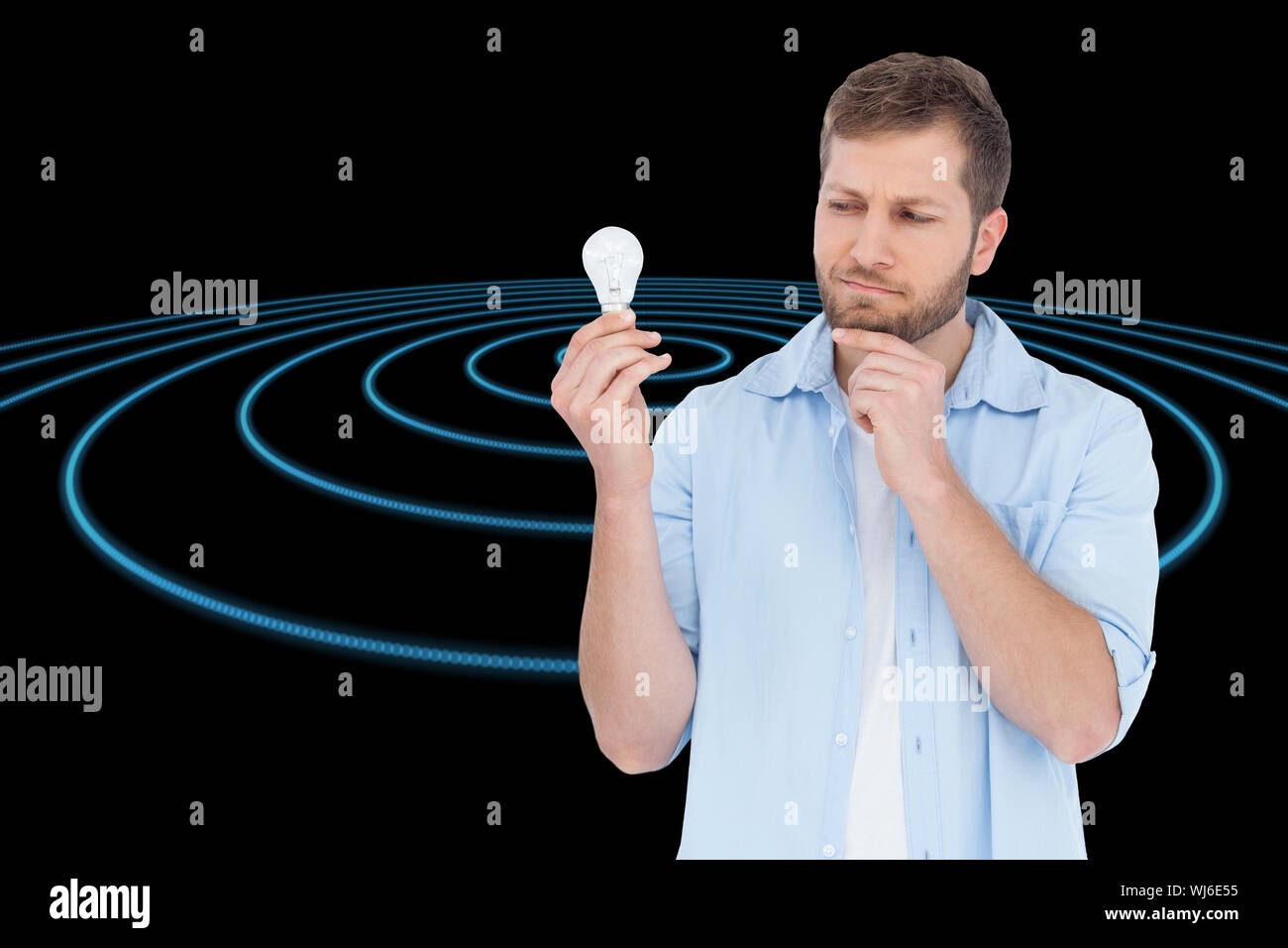 Composite image of sceptical model on white background holding a bulb ...