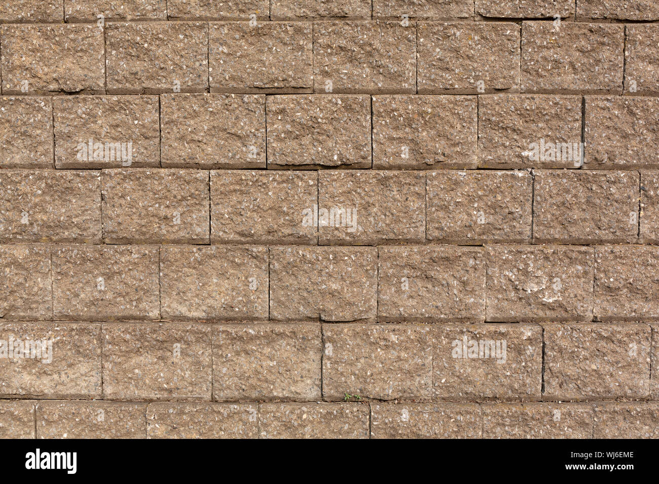 Several rows of blocks used for a landscape retaining wall in the early ...