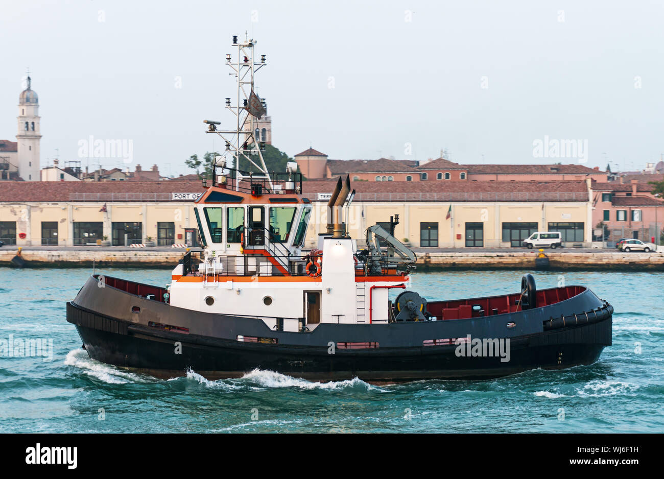 Tug boat in front of the old port terminal in Venice, Italy Stock Photo ...