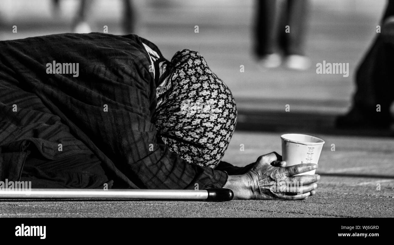 Begging cup hi-res stock photography and images - Alamy