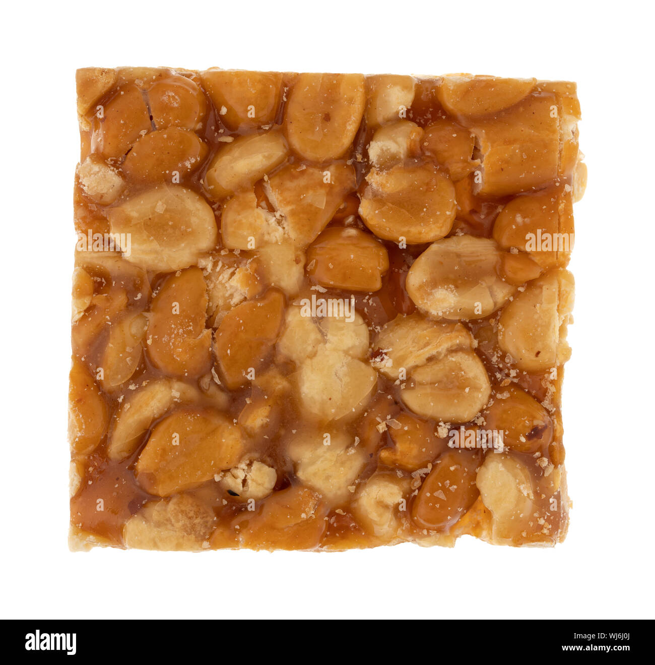 Single piece of peanut crunch candy isolated on a white background ...