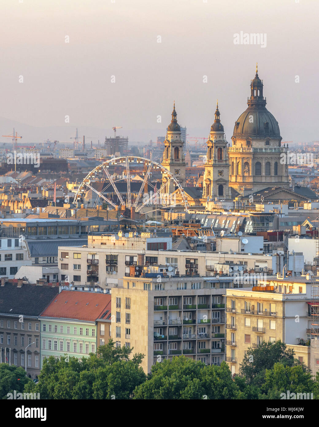 The towers and dome of St Stephen's Basilica at golden hour in Budapest ...
