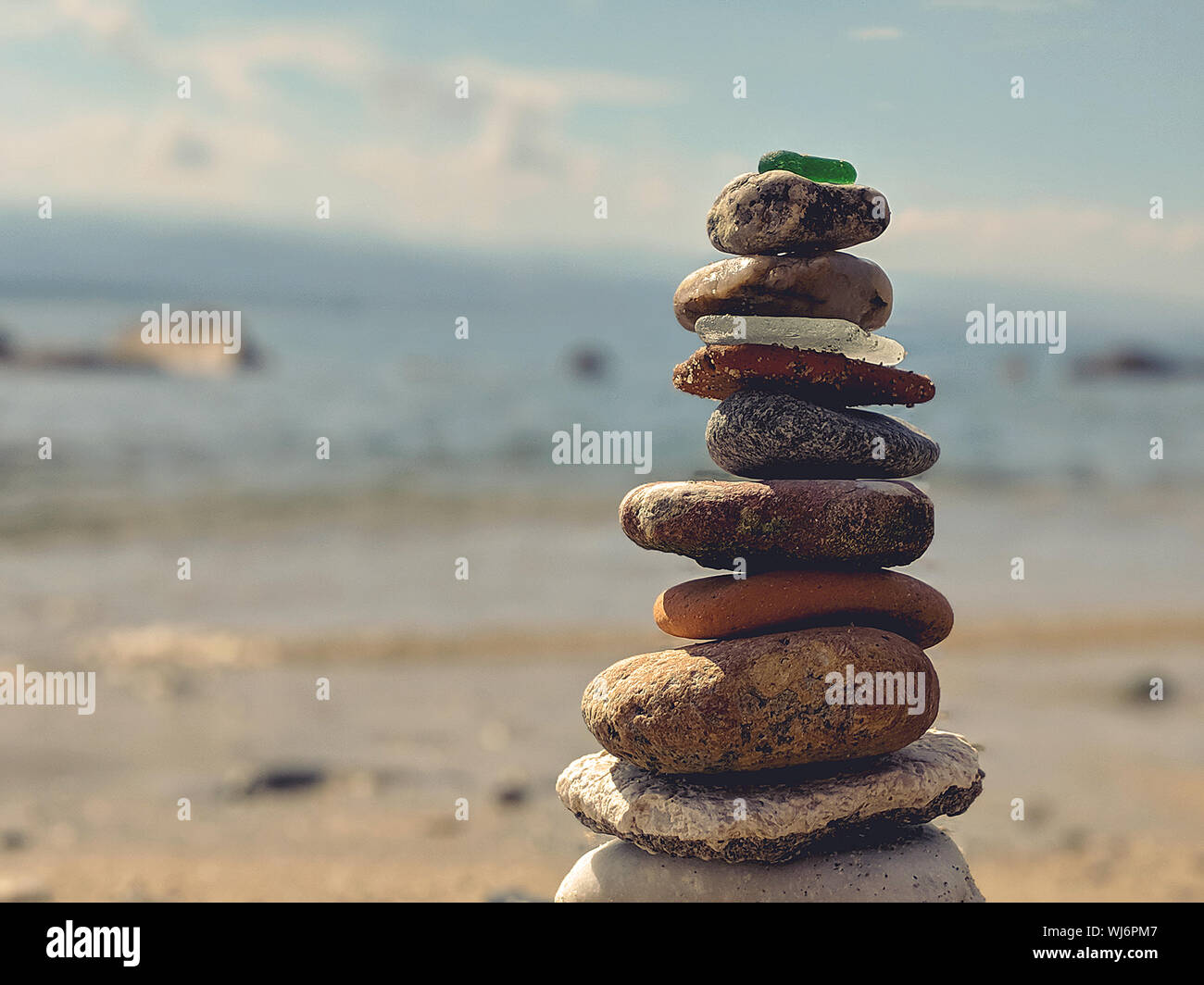 Rock balancing by the beach Stock Photo - Alamy