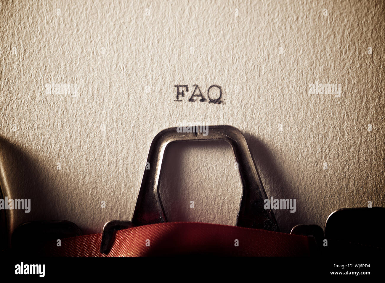 The abbreviation, FAQ, written with a typewriter Stock Photo - Alamy