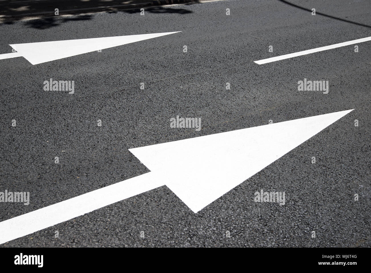 Two arrow directional signals on the floor Stock Photo - Alamy