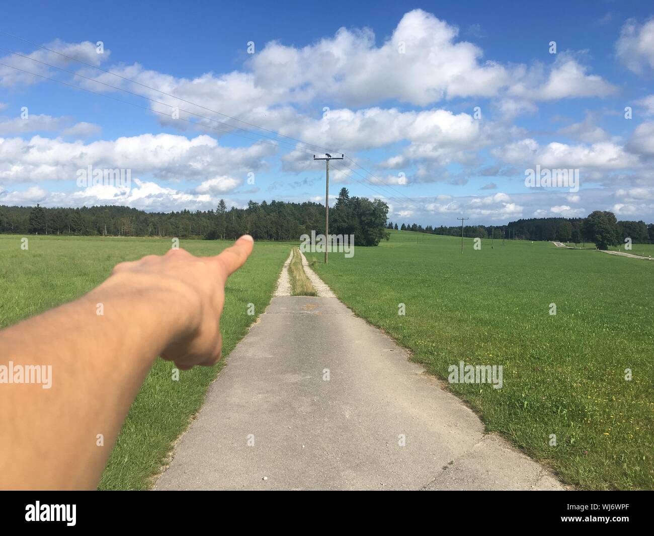 Person pointing the way hi-res stock photography and images - Alamy