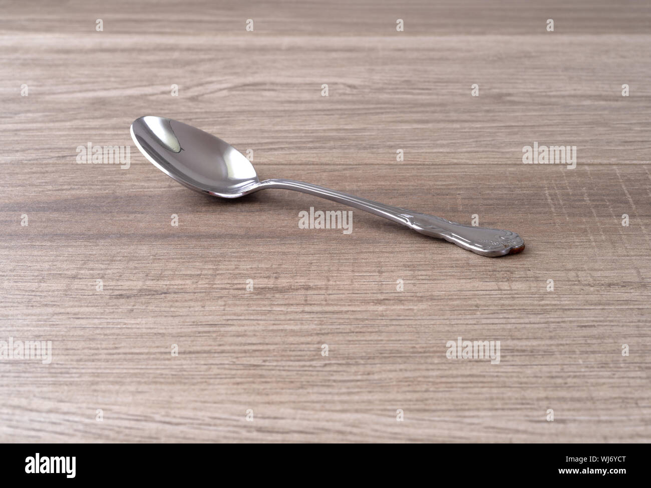 Side view of a generic teaspoon on a countertop Stock Photo - Alamy
