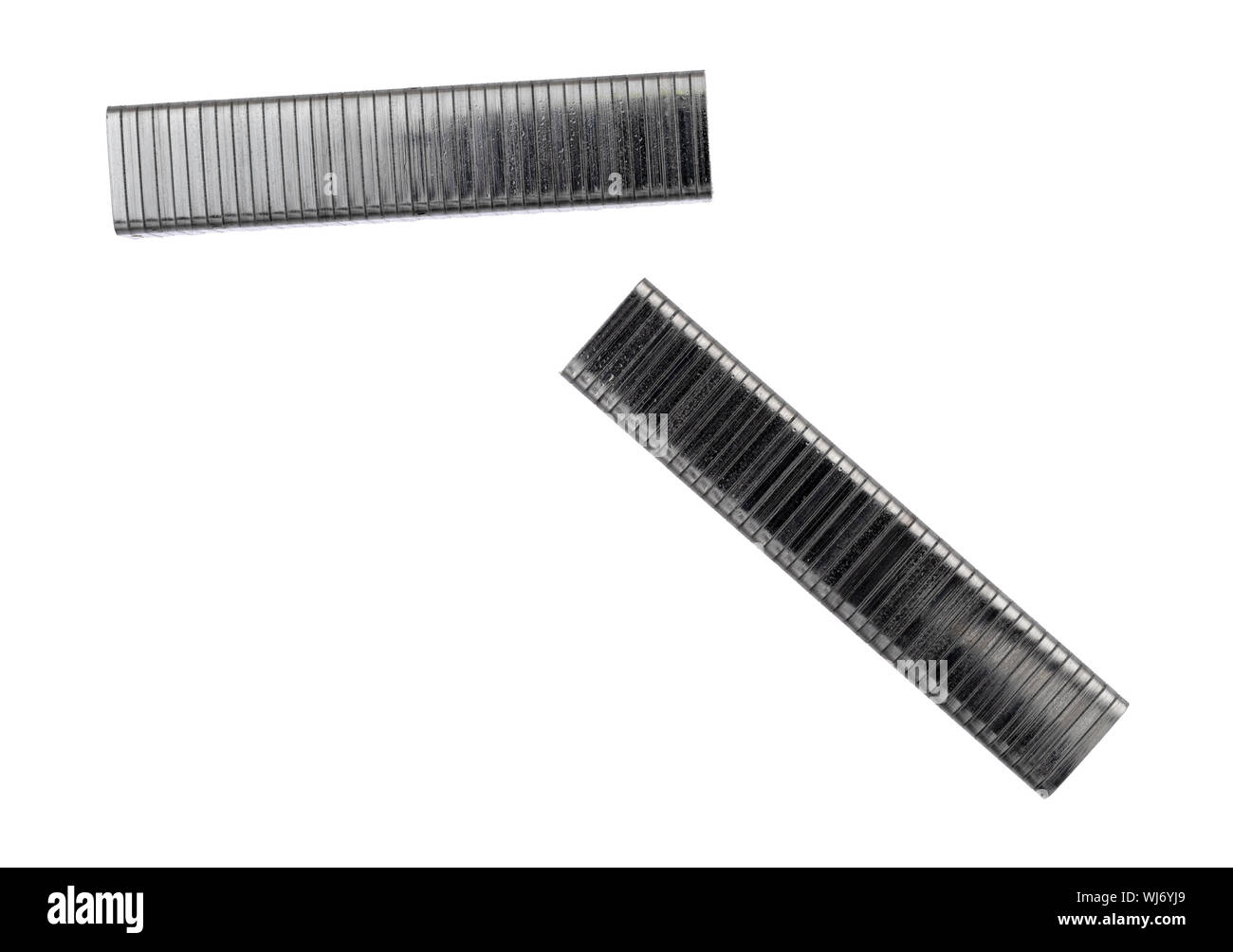 Two sections of industrial steel staples on a white background Stock ...