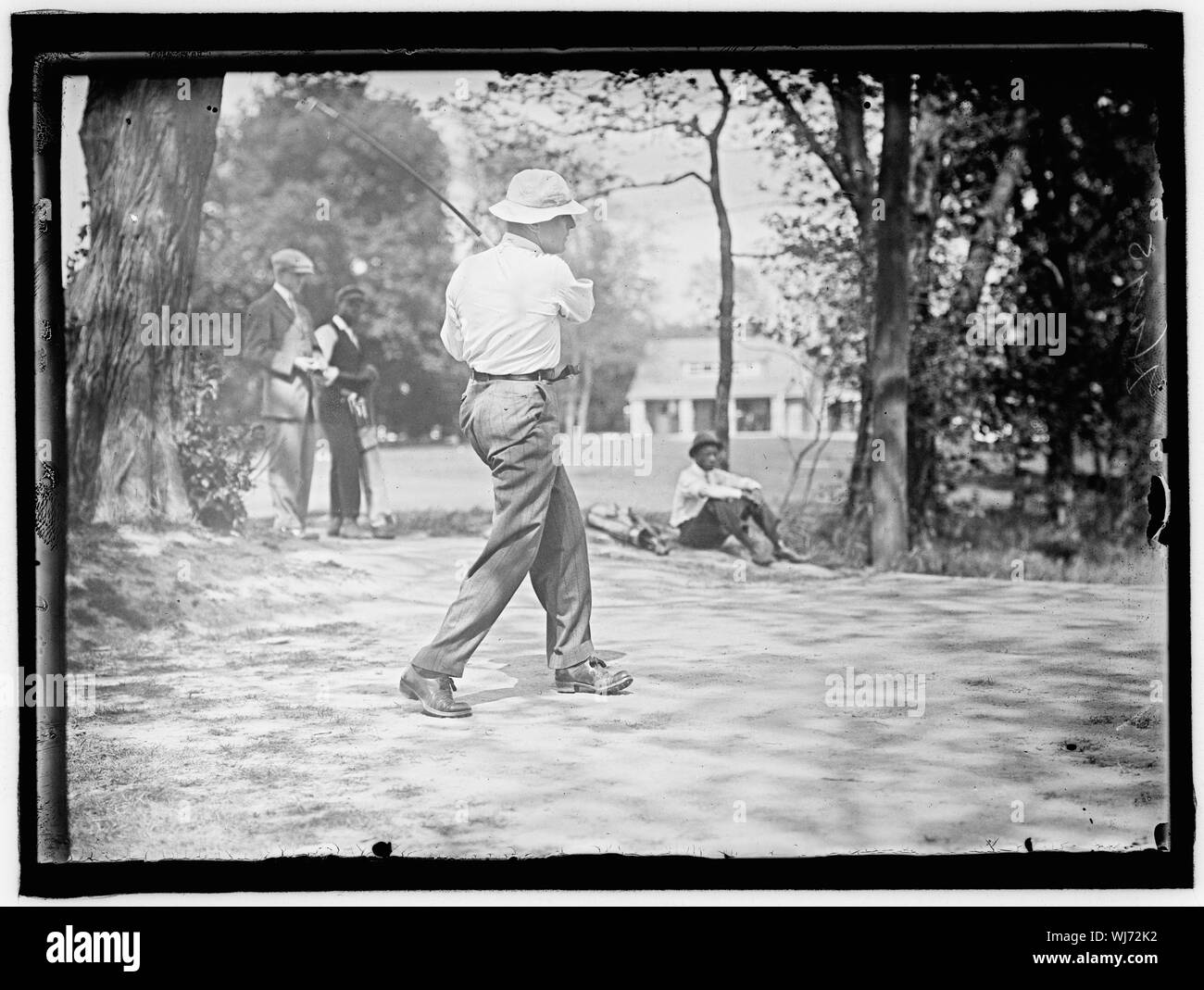 Playing golf on public Black and White Stock Photos & Images - Alamy