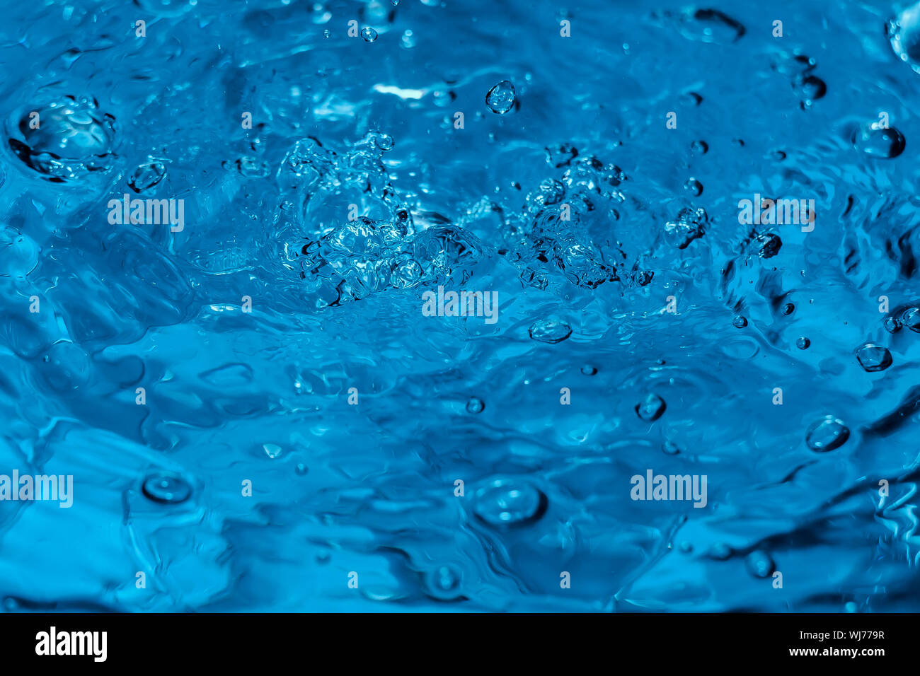 Drop of water. Blue water drop. Falling water. Water splash close-up ...