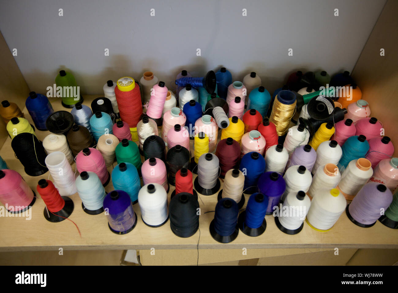rows of colourful thread Stock Photo - Alamy