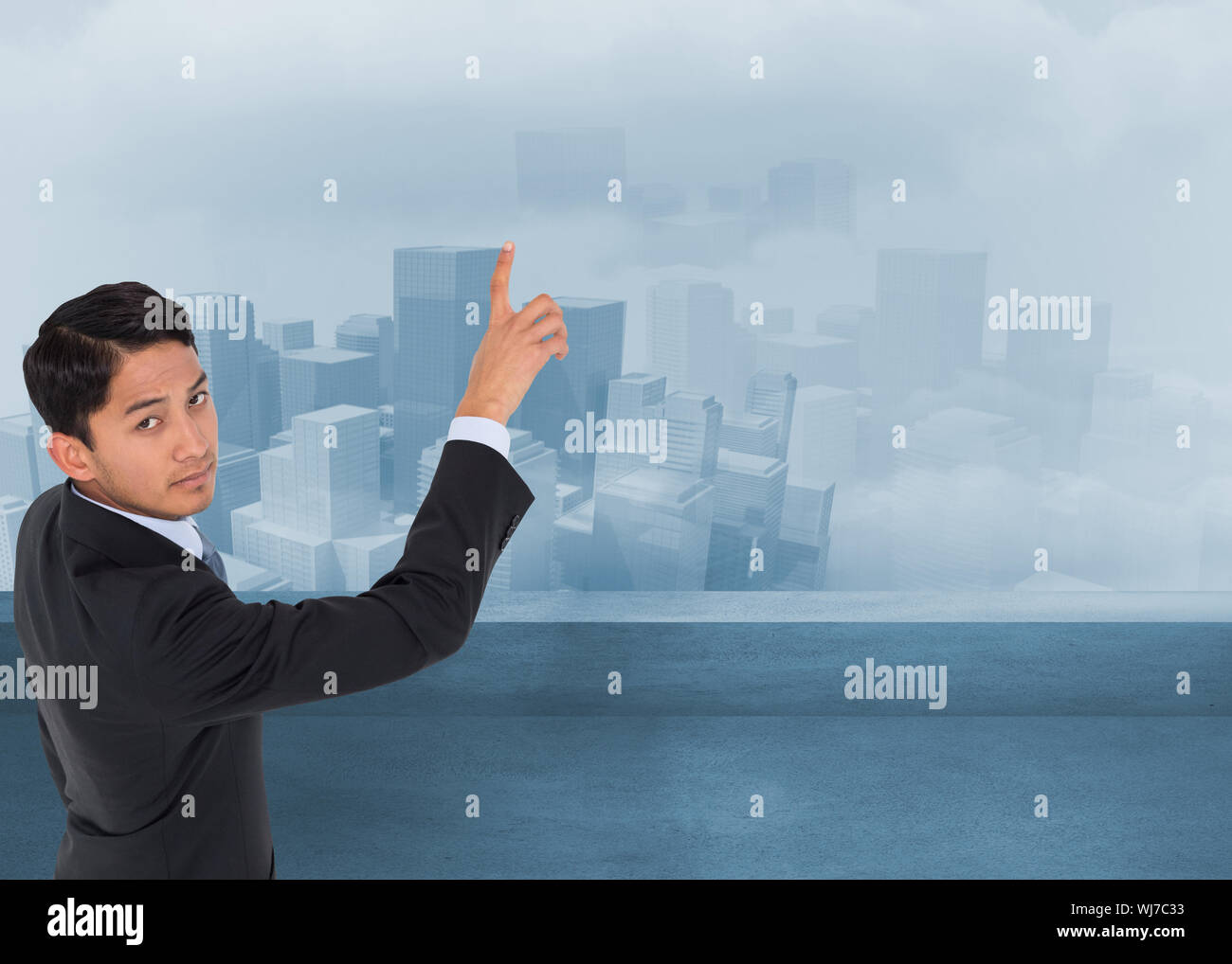 Composite image of stern asian businessman pointing Stock Photo - Alamy