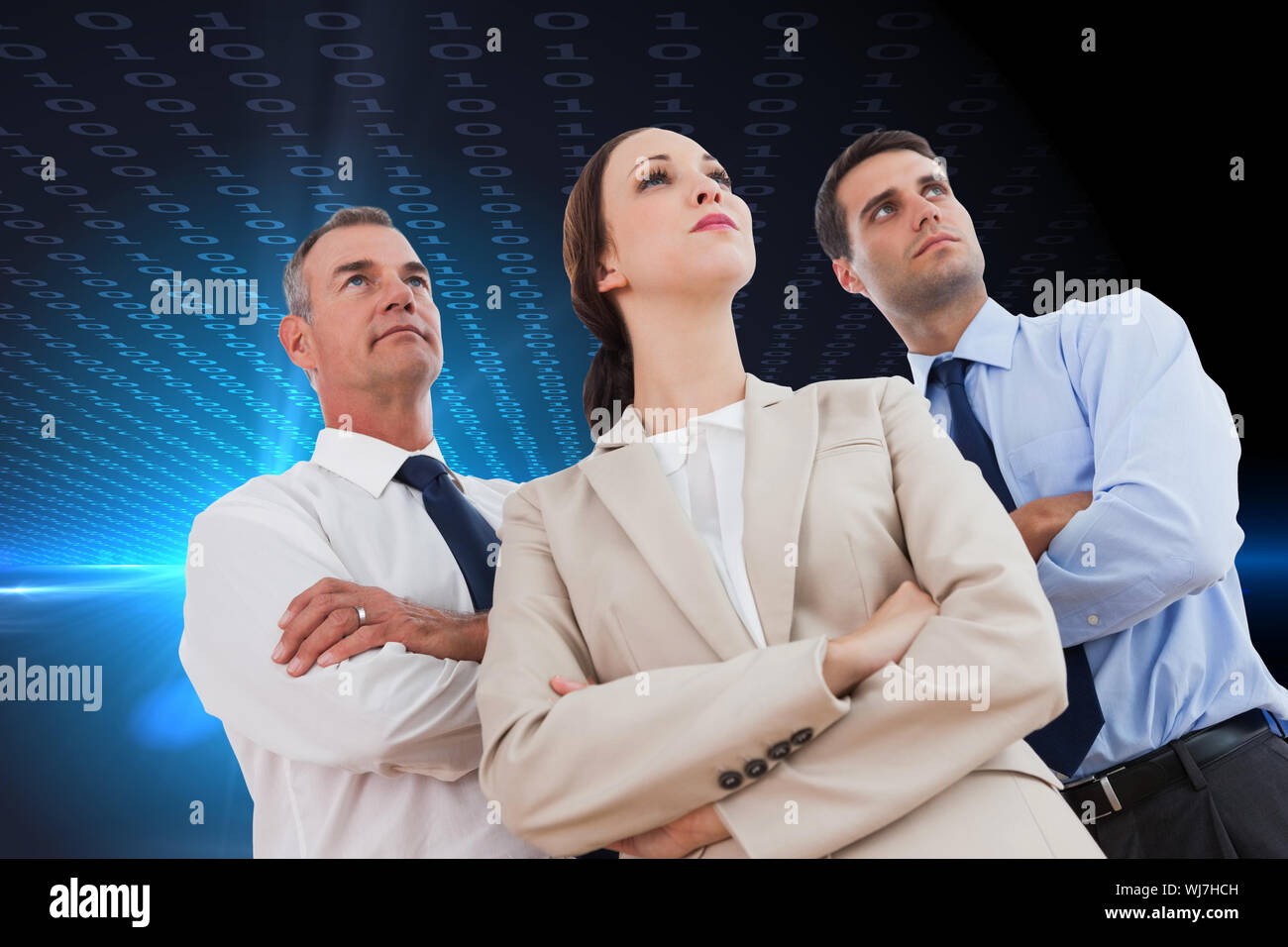 Composite image of serious work team posing together looking away on ...