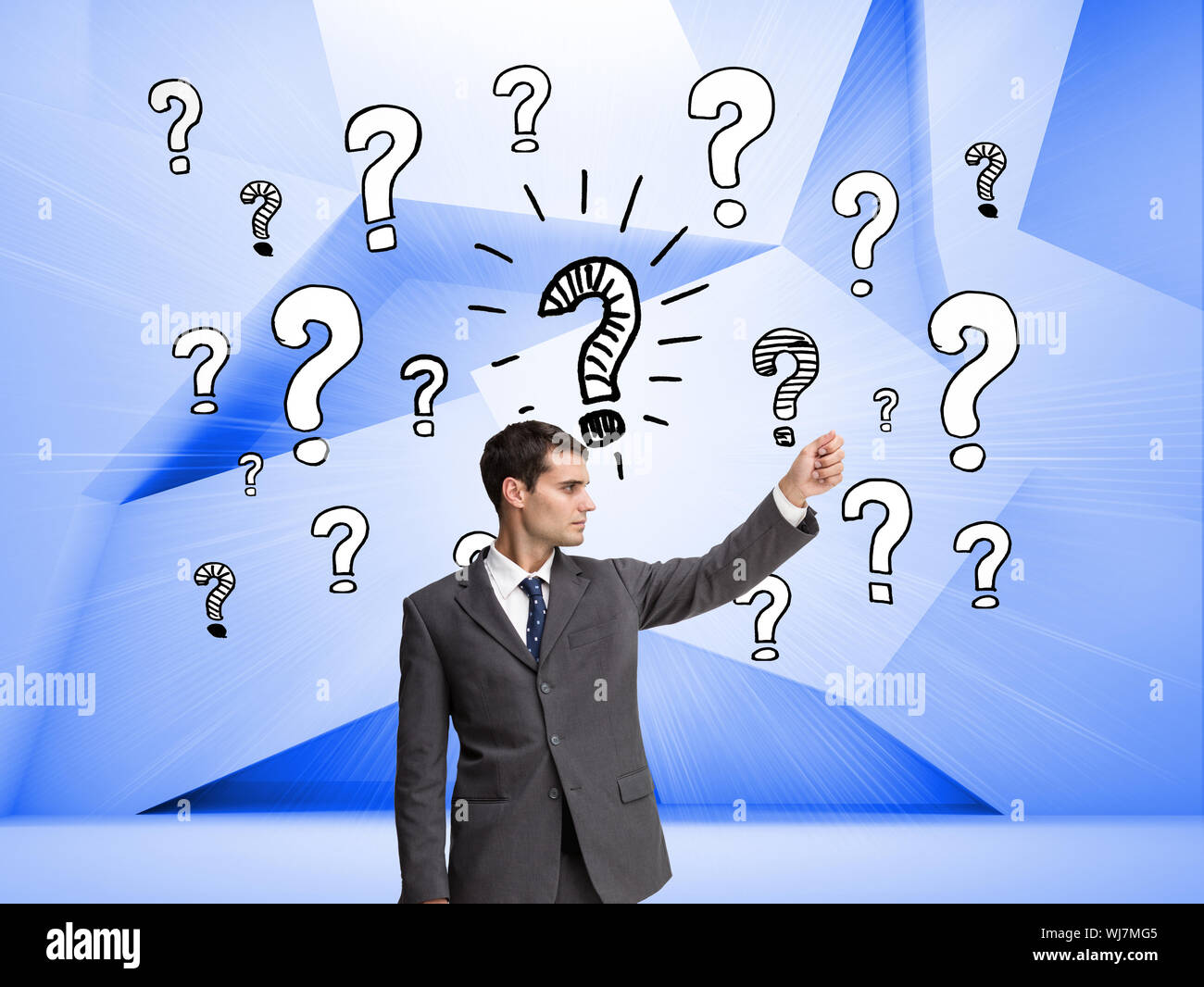 Composite image of stern attractive businessman pointing Stock Photo ...