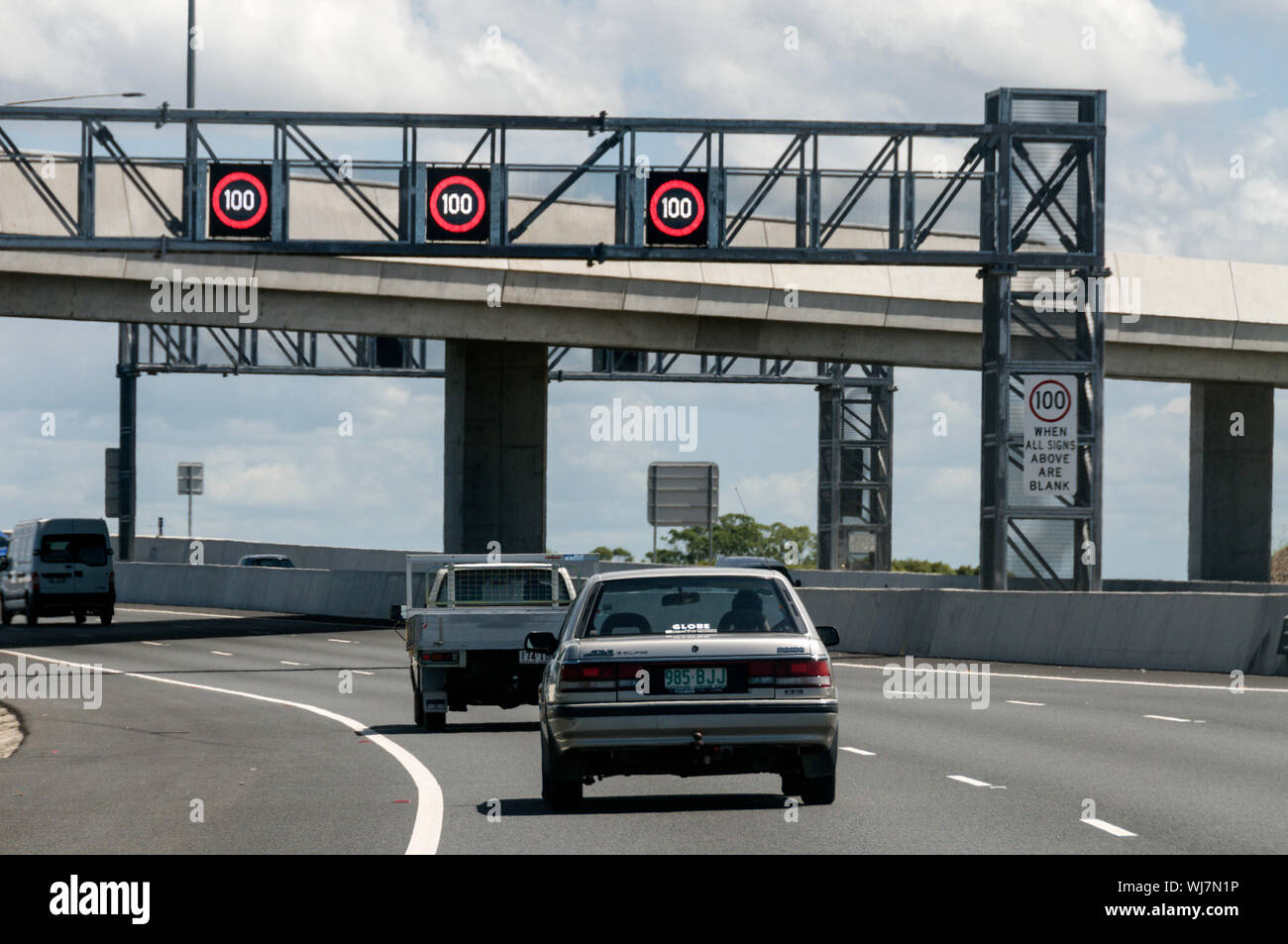 A gantry on the M1 also known as the Bruce Highway, indicating 80km ...