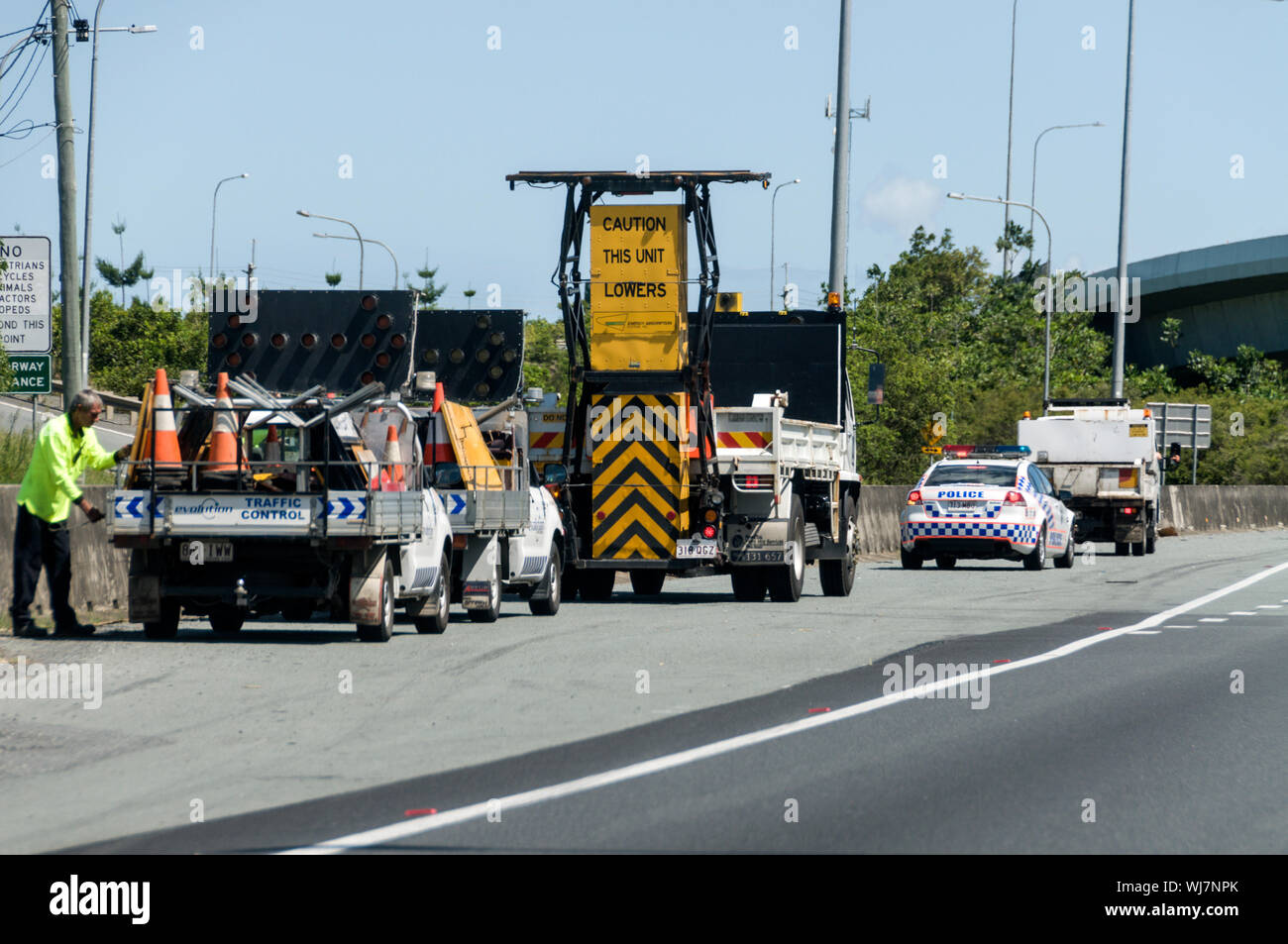 A road works resurfacing team on the M1 Highway in Queensland ...