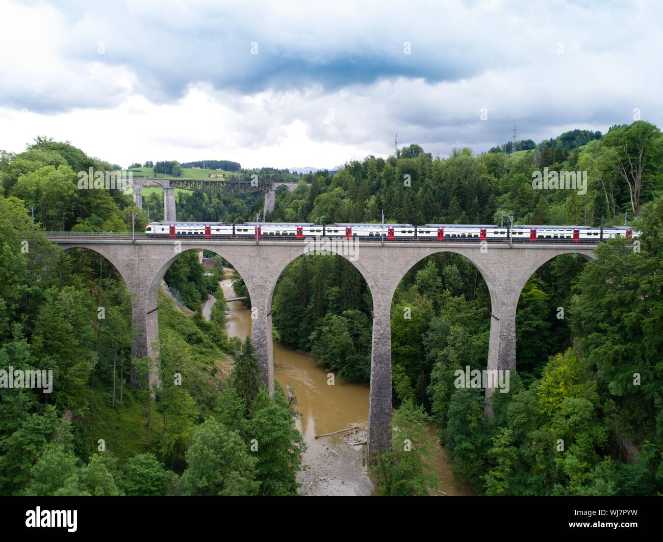 Aerial photo SBB viaduct with train entering Stock Photo - Alamy
