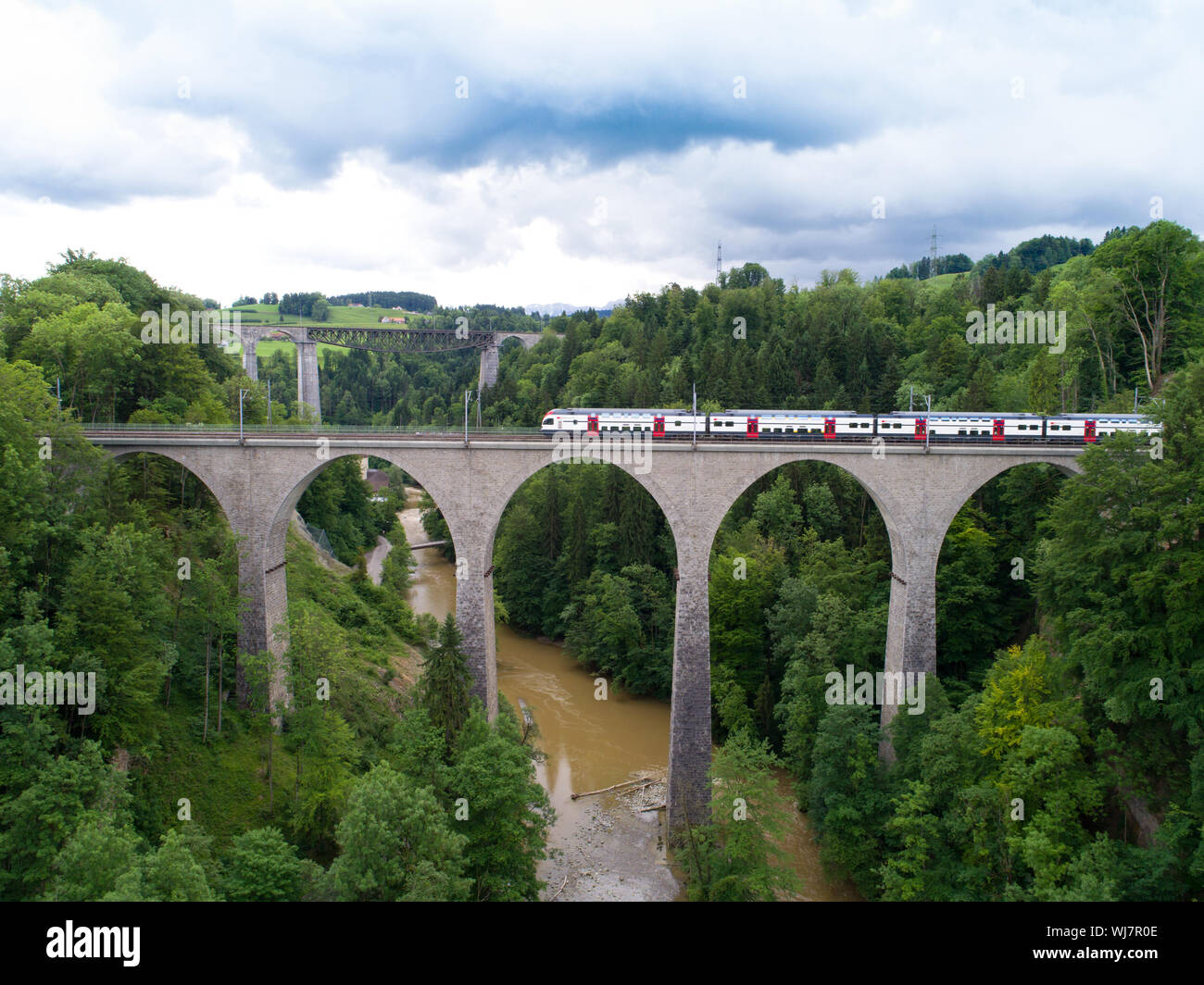 Aerial view of incoming train on viaduct Stock Photo - Alamy