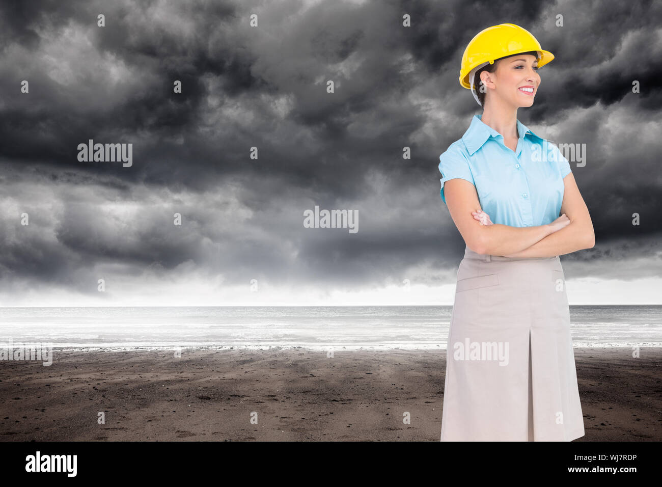 Composite image of smiling attractive architect posing Stock Photo - Alamy