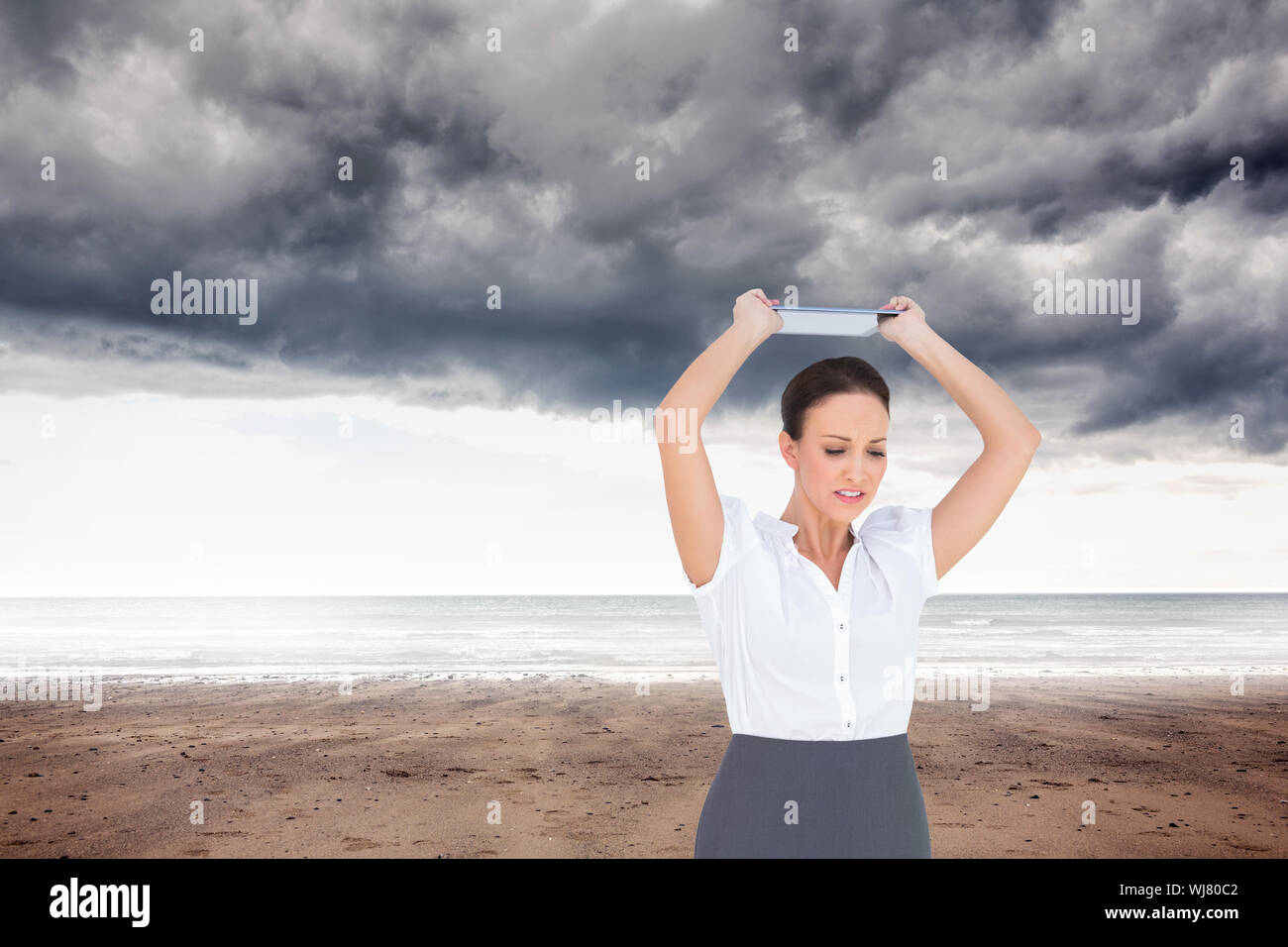 Composite image of angry businesswoman throwing her tablet pc while ...