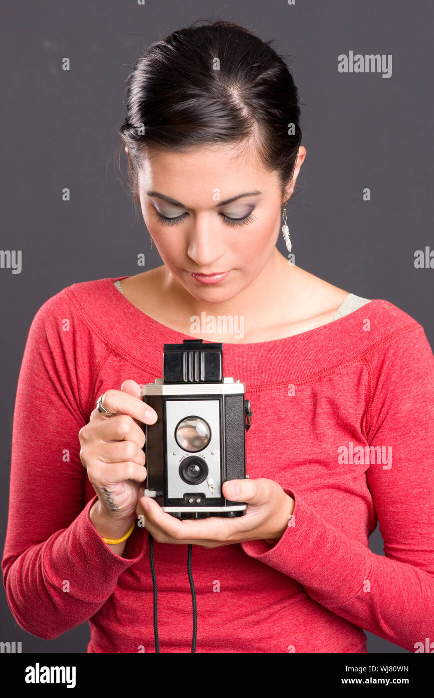 Pretty Woman practicing photography Stock Photo - Alamy