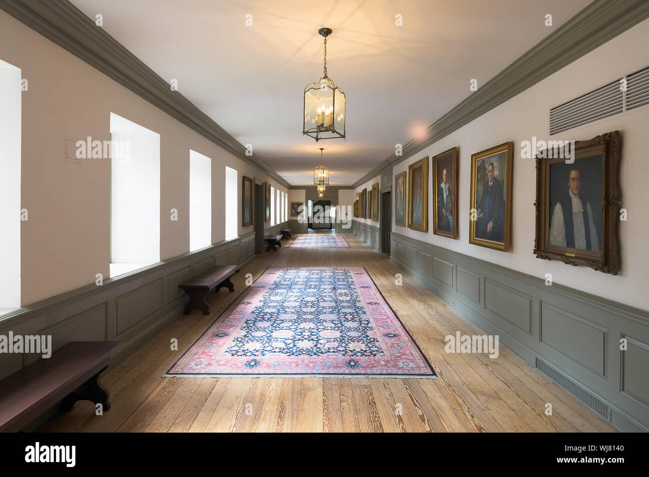 Corridor of portraits inside the historic Wren Building on the campus ...