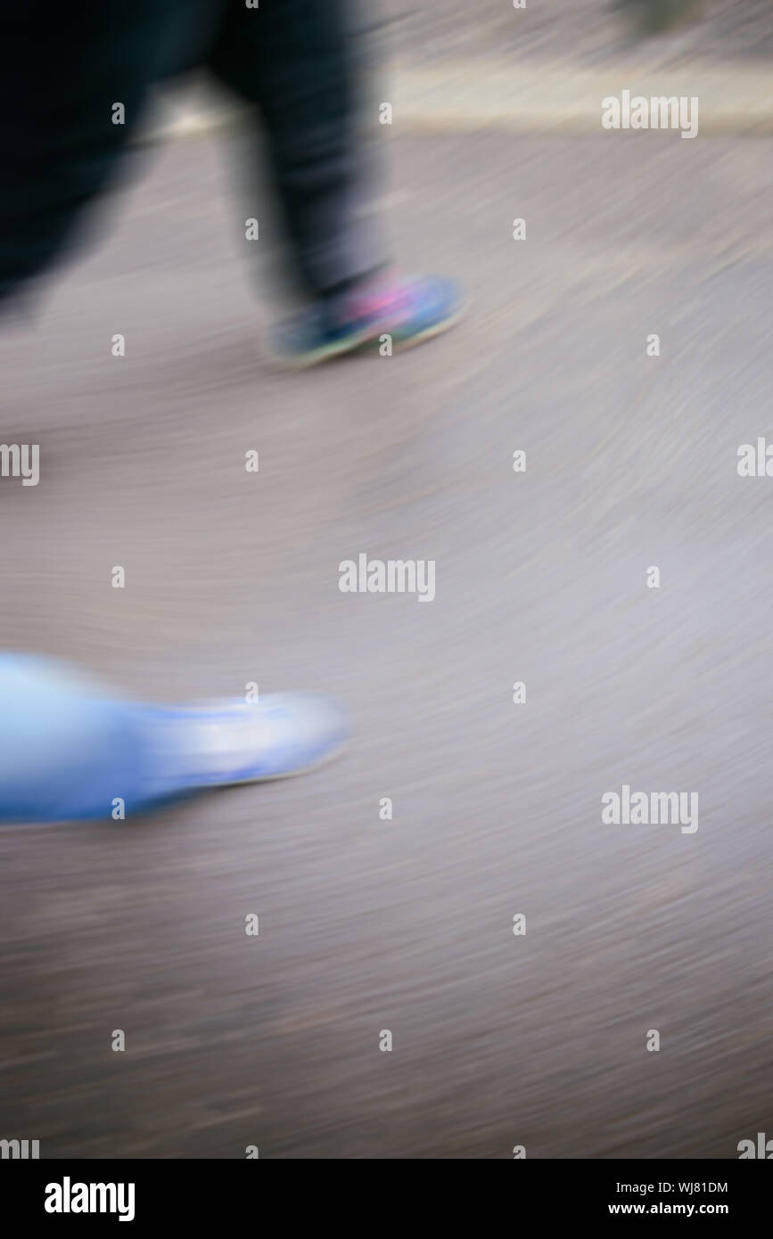 Walking legs - human in sidewalk. Summer time Stock Photo - Alamy