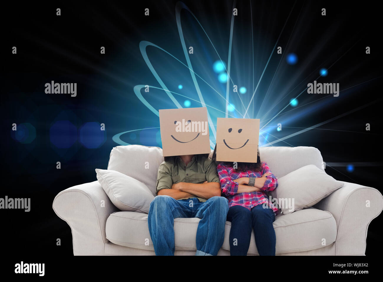 Composite image of silly employees with arms folded wearing boxes on ...