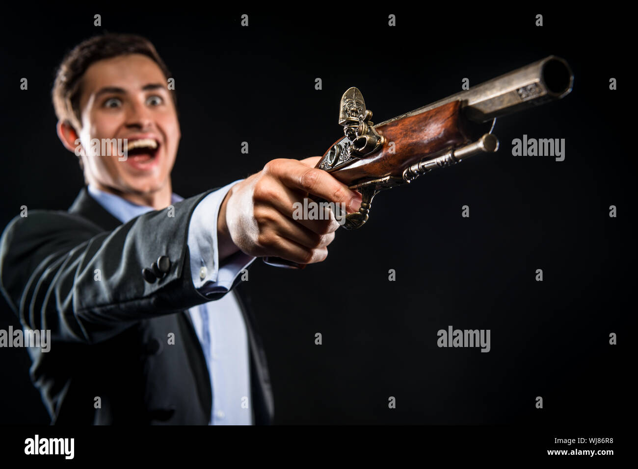 Hand Holding A Gun High Resolution Stock Photography and Images - Alamy