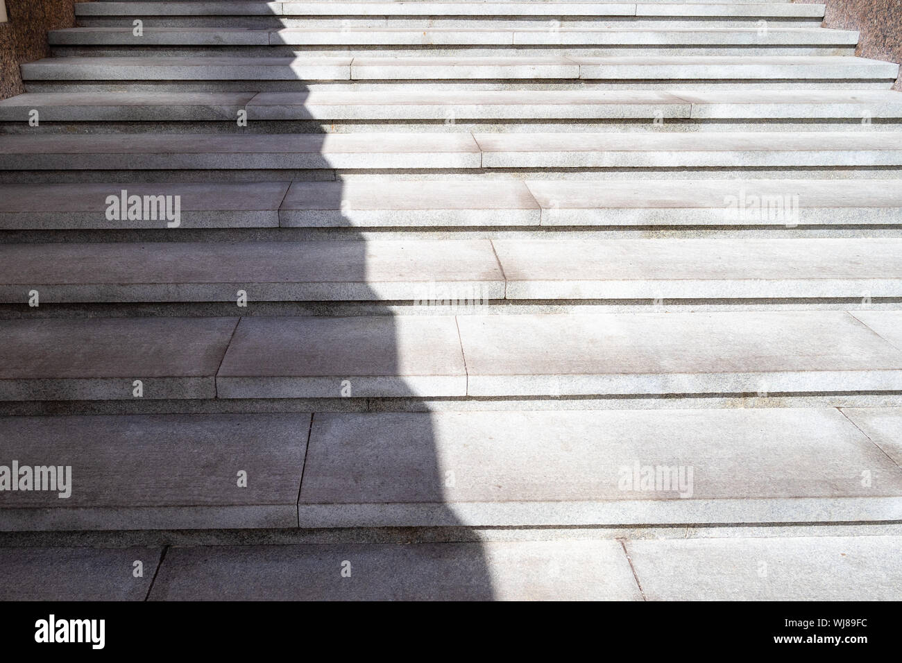 wide gray granite steps of street underground pedestrian crossing and ...