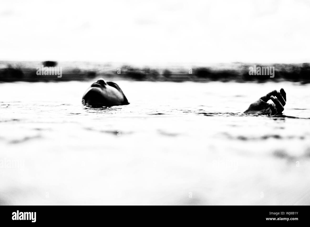 Man floating in water hi-res stock photography and images - Alamy